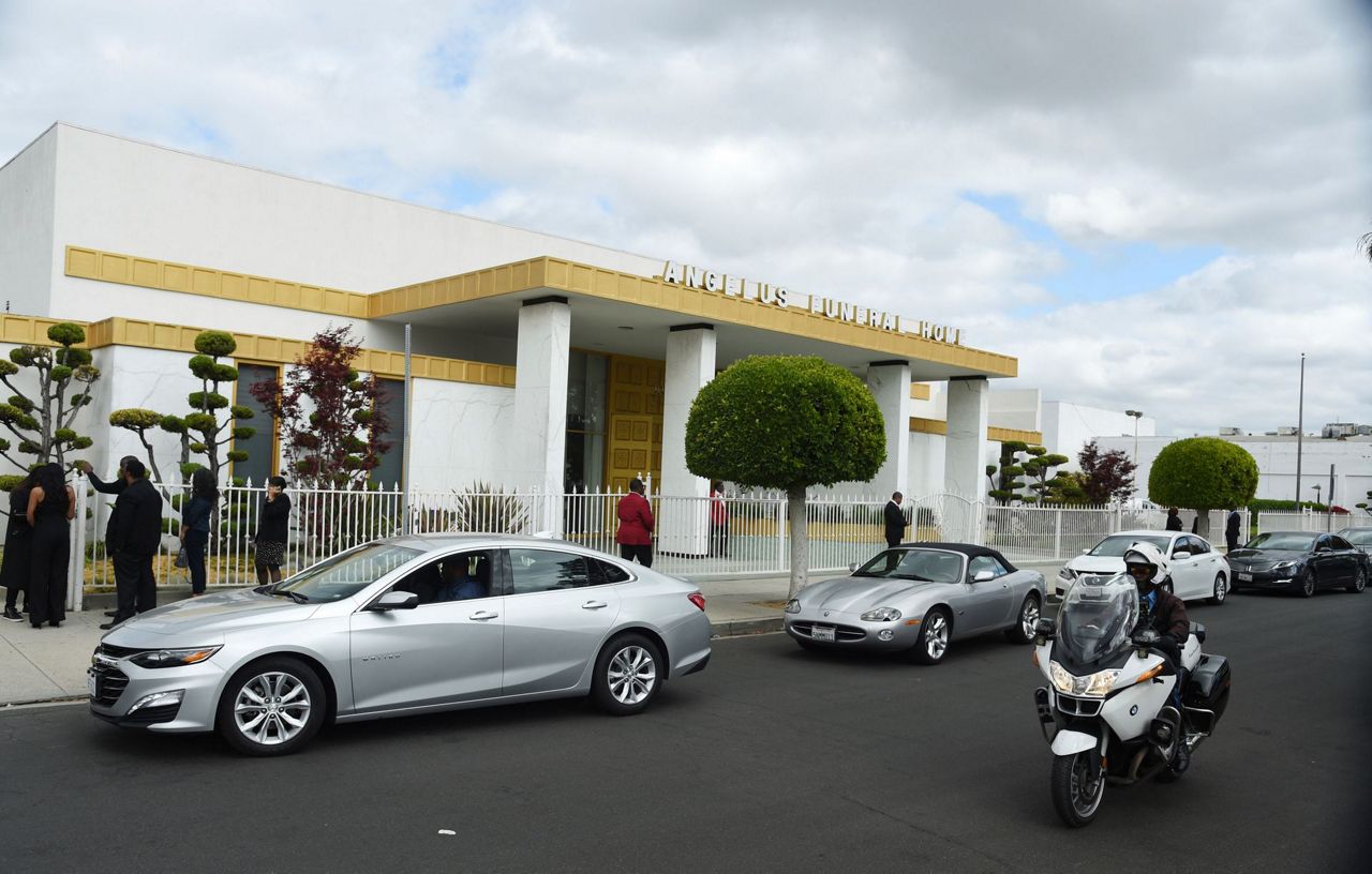 Ice Cube, others mourn director Singleton at private funeral