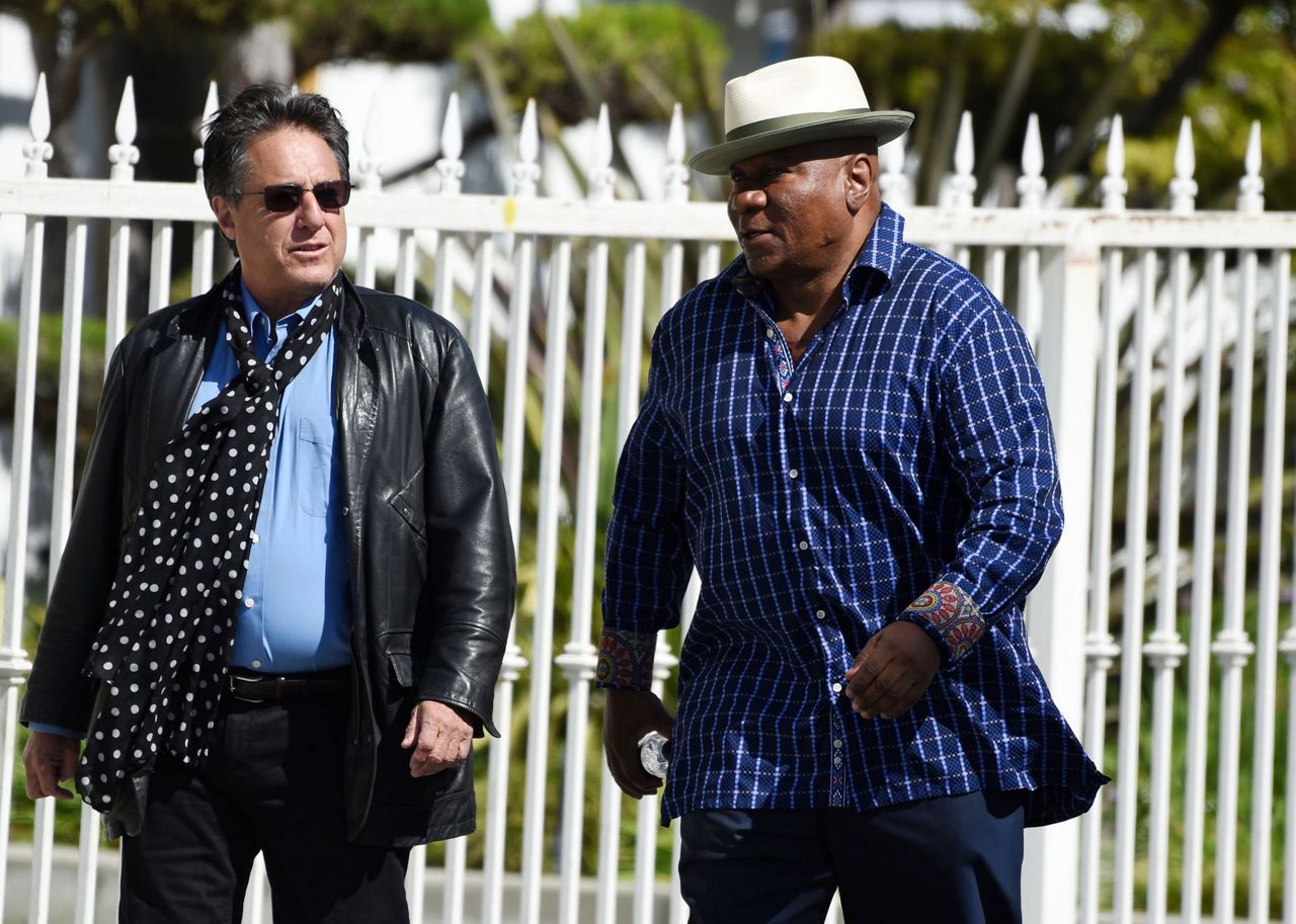 Ice Cube, others mourn director Singleton at private funeral