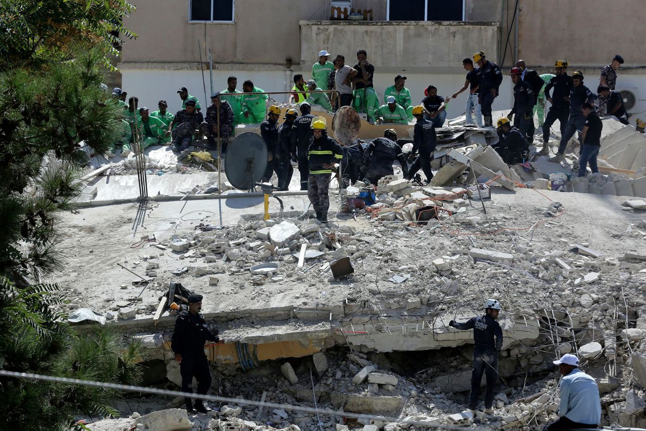 At least 10 still trapped in Jordan building collapse