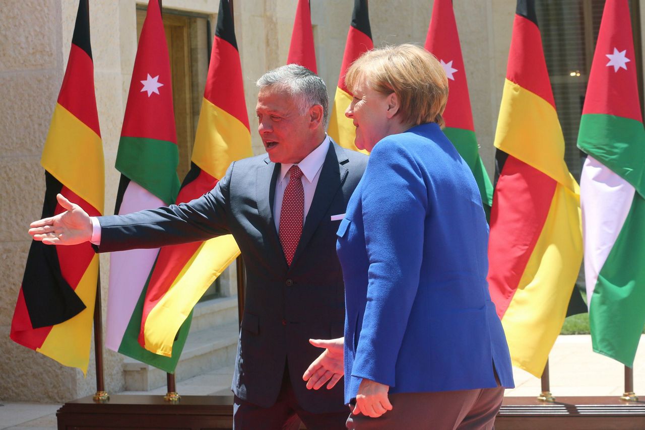 Merkel visits refugee host Jordan amid migration row at home