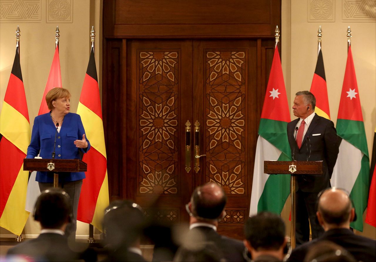 Merkel visits refugee host Jordan amid migration row at home