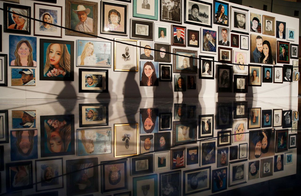 Vegas shooting victims' families view loved ones' portraits