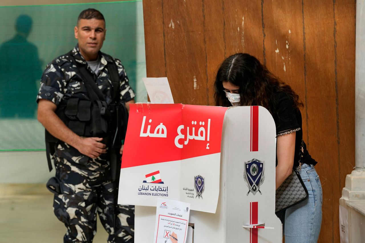 Mired in crises, Lebanese begin voting for new parliament