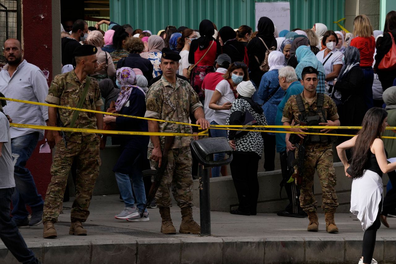 Mired in crises, Lebanese begin voting for new parliament