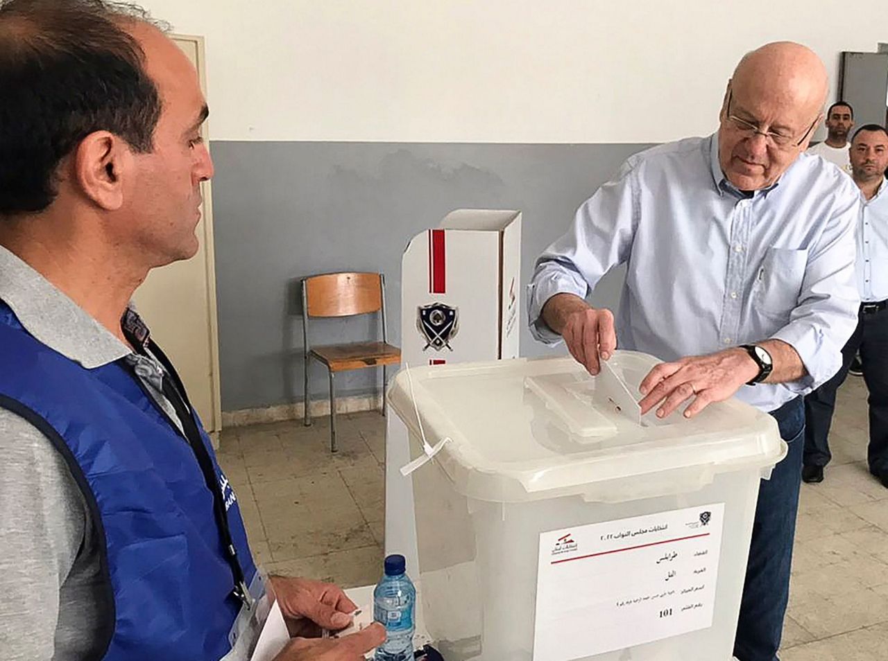 Mired in crises, Lebanese begin voting for new parliament