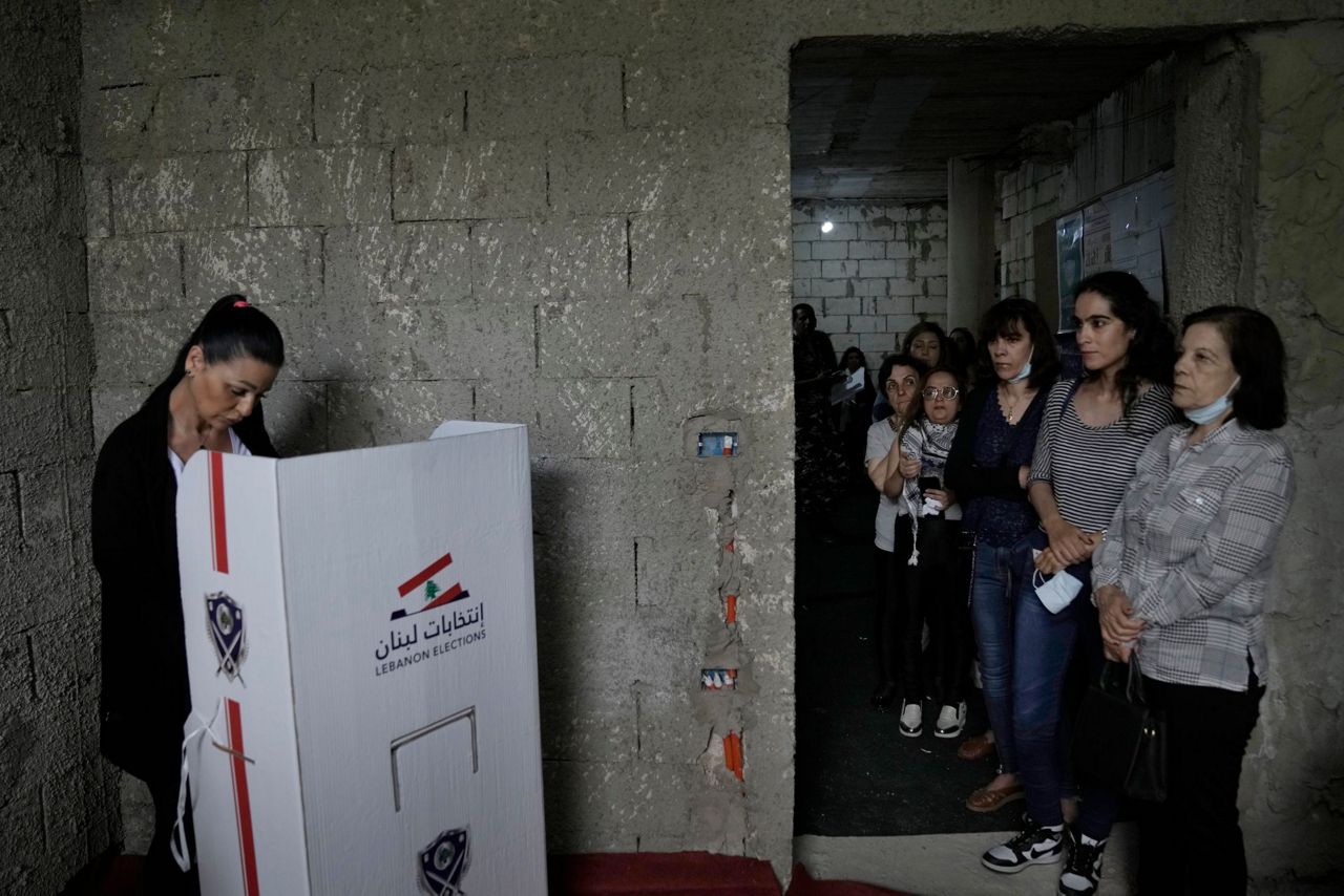 Mired in crises, Lebanese begin voting for new parliament