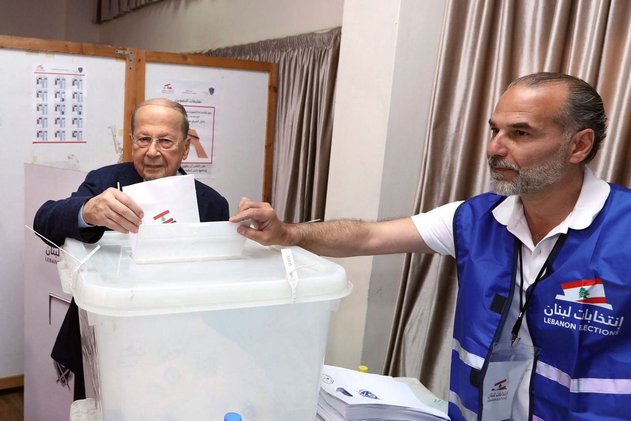 Mired in crises, Lebanese begin voting for new parliament