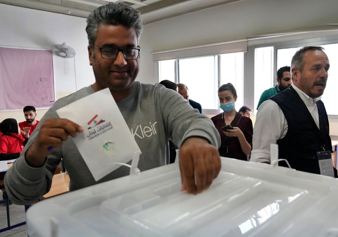 Mired in crises, Lebanese begin voting for new parliament
