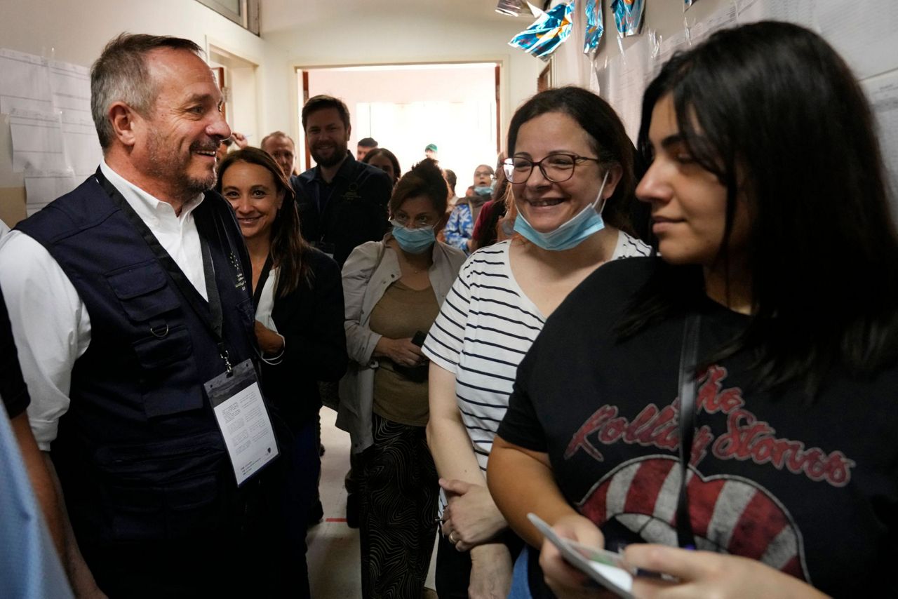 Mired in crises, Lebanese begin voting for new parliament