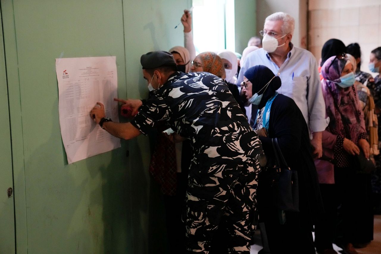 Mired in crises, Lebanese begin voting for new parliament