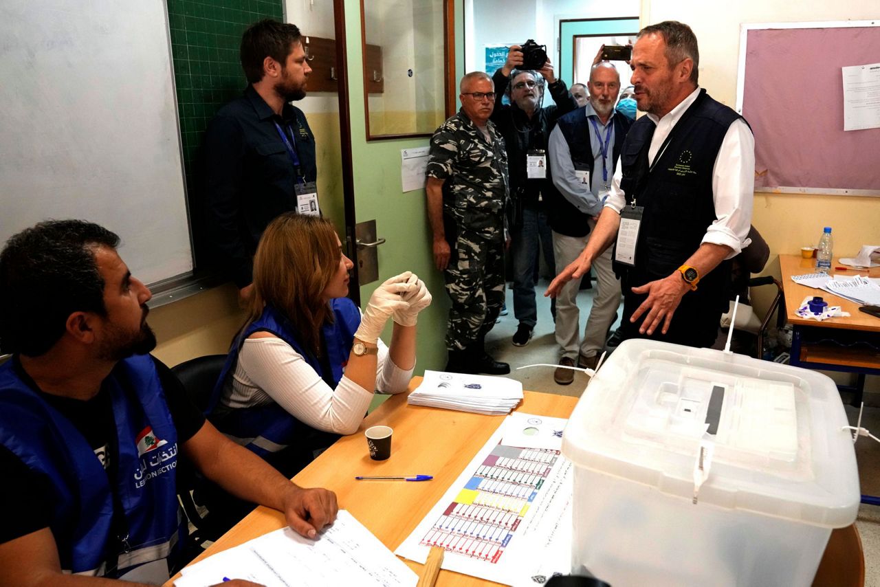 Mired in crises, Lebanese begin voting for new parliament