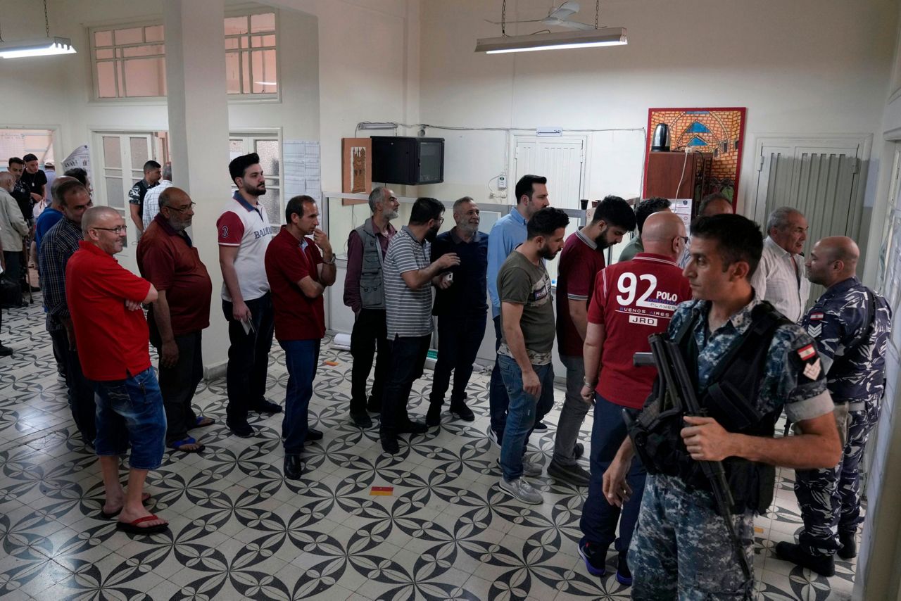 Mired in crises, Lebanese begin voting for new parliament