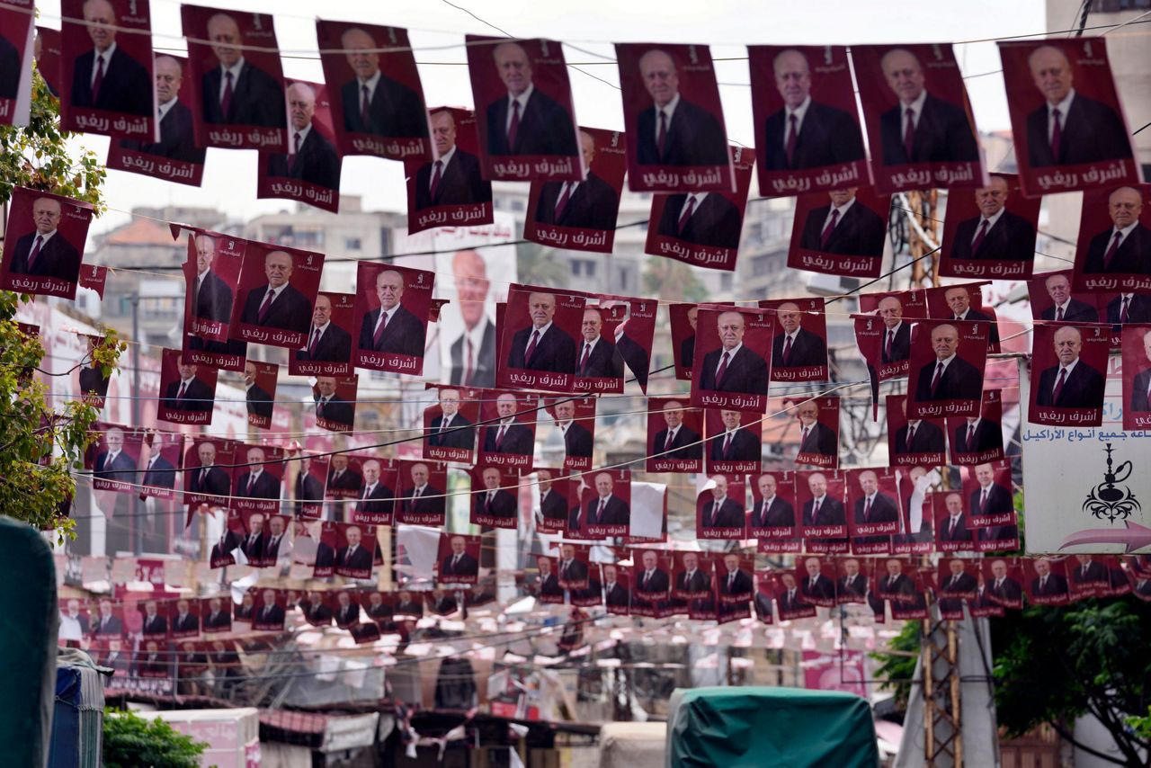Mired in crises, Lebanese begin voting for new parliament