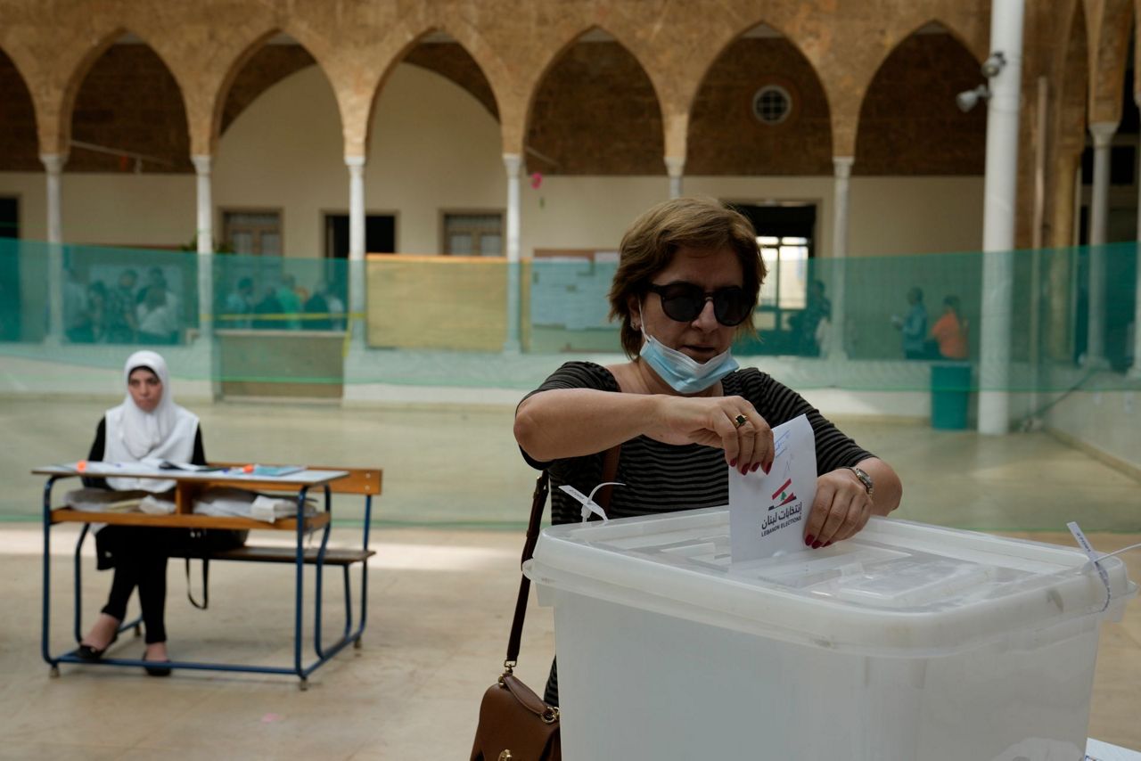 Mired in crises, Lebanese begin voting for new parliament