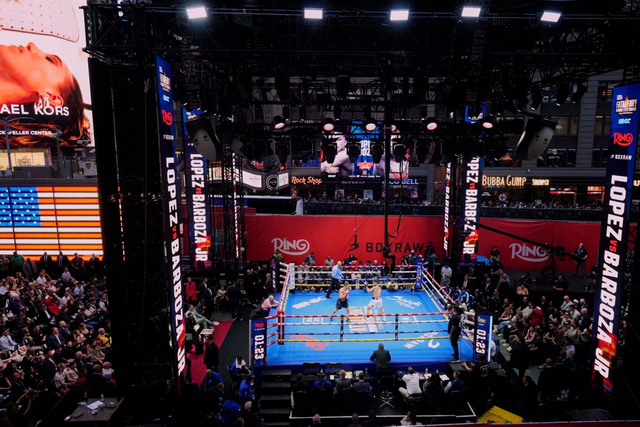 Times Square boxing event sees Teofimo Lopez defend his title, with ...