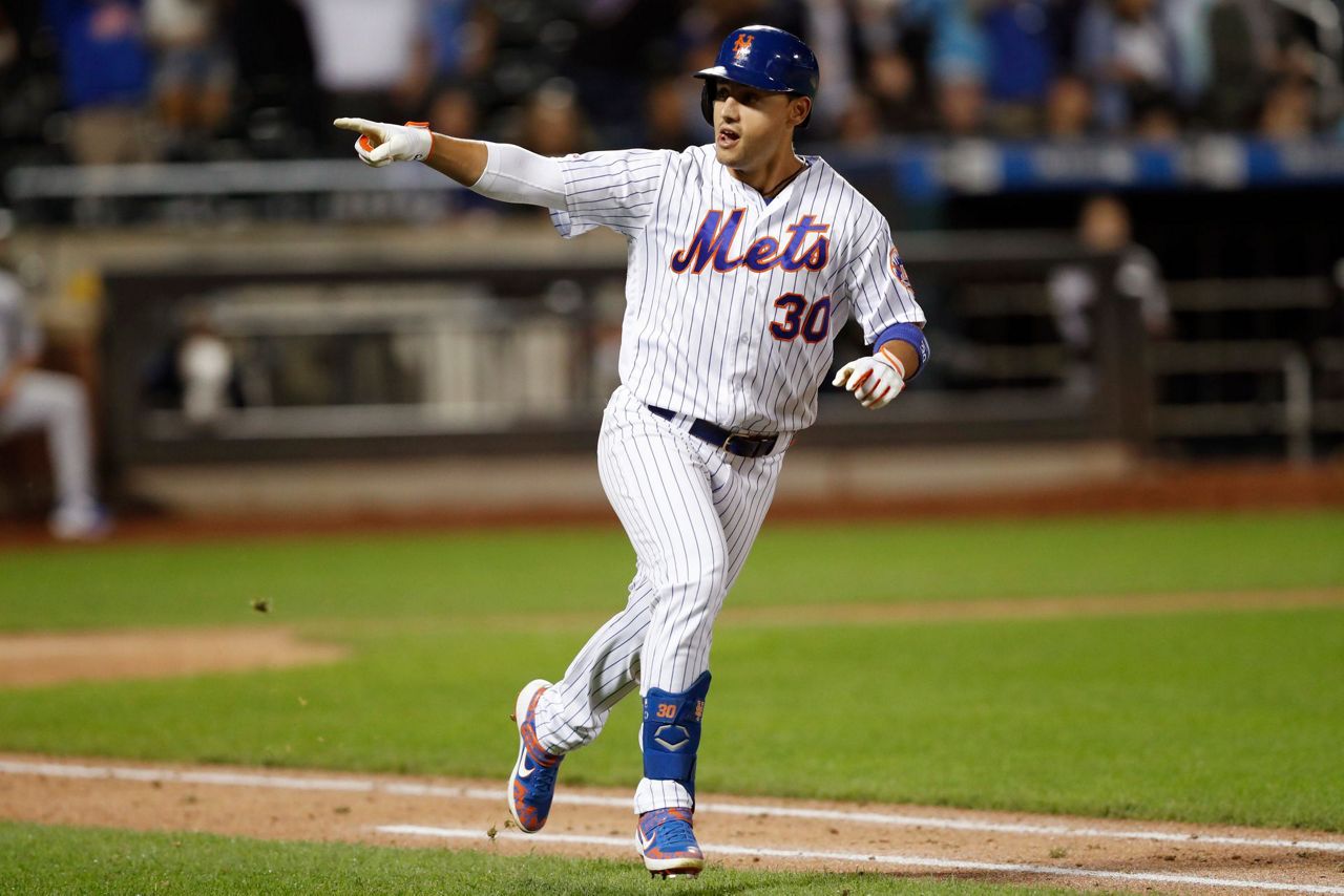 Mets stay alive, rally in 9th and beat Marlins 5-4 in 11