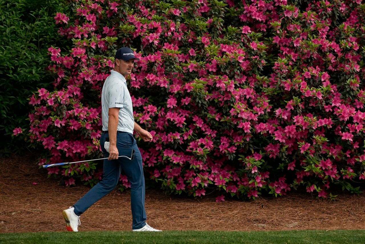 The Latest: Elder raises driver in honorary start at Masters