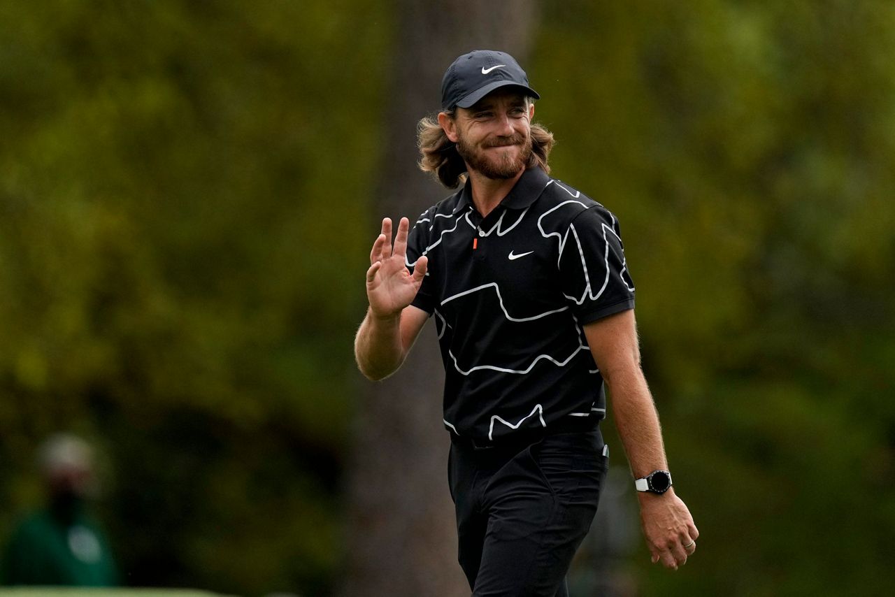The Latest: Elder raises driver in honorary start at Masters