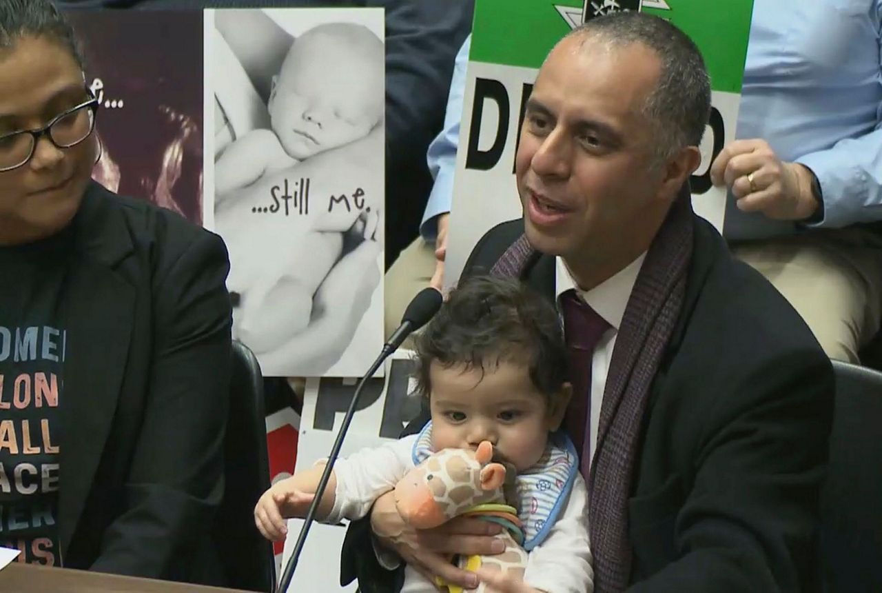 Baby in the office? Providence mayor's habit sparks debate