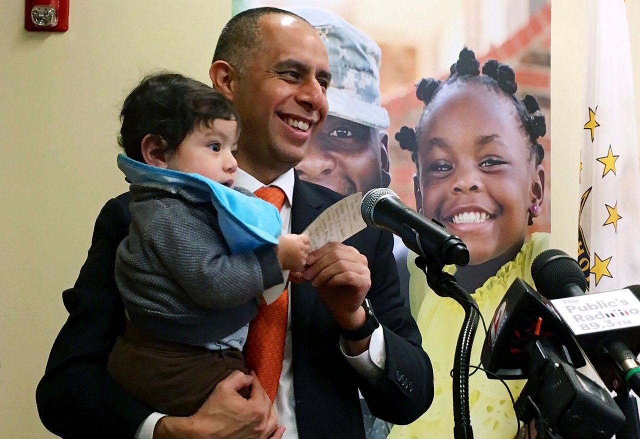 Baby in the office? Providence mayor's habit sparks debate