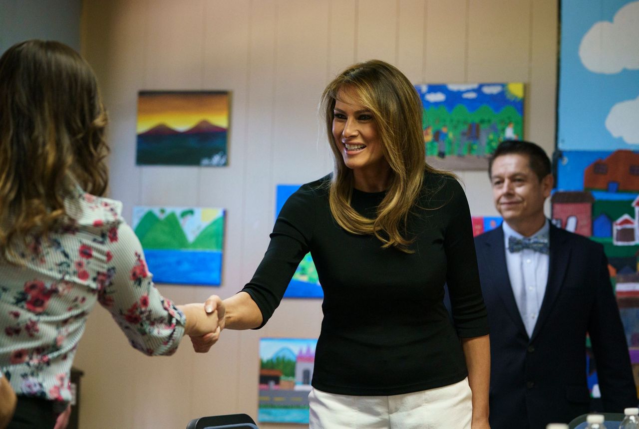 The Latest: Sans jacket, Melania Trump departs on trip