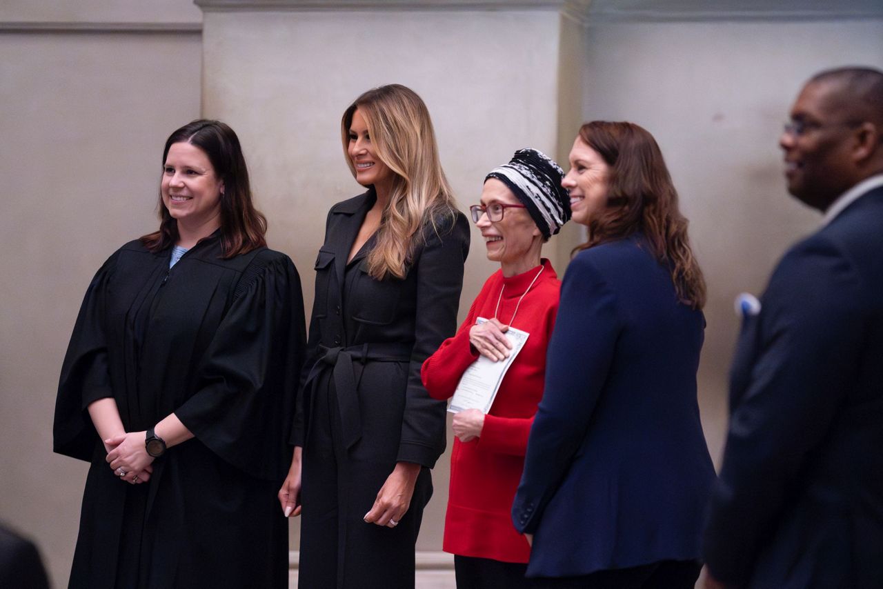 In a rare appearance, Melania Trump welcomes new citizens at a National ...
