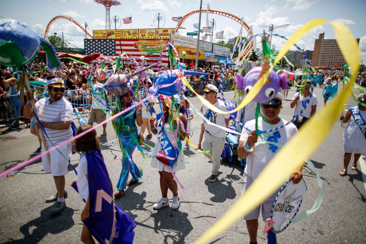 Woody Guthrie's children named Mermaid Parade king and queen