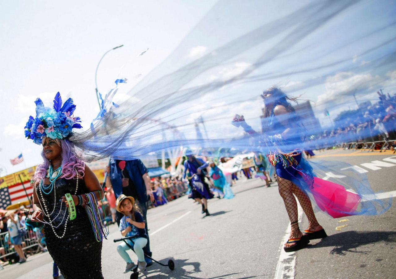 Woody Guthrie's children named Mermaid Parade king and queen