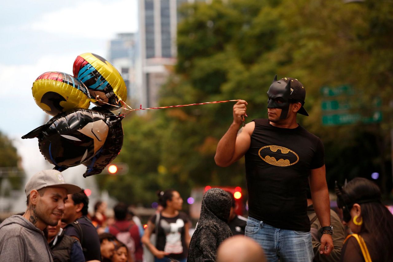 Holy anniversary! Displays of bat signal fete Batman at 80