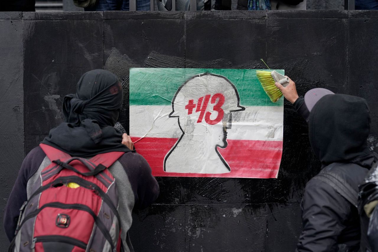 Families of Mexico's missing students march on anniversary