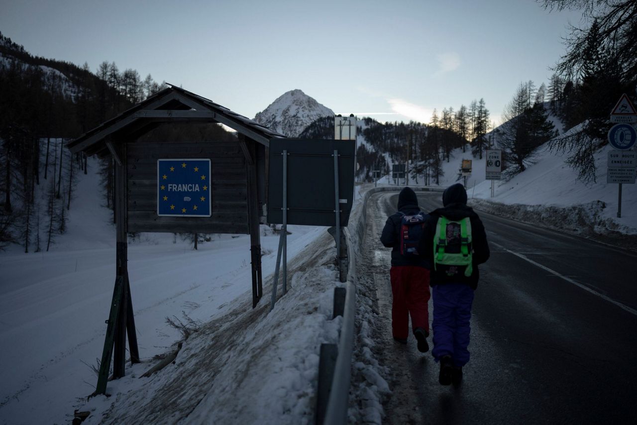 Freezing in the Alps, migrants find warm hearts and comfort