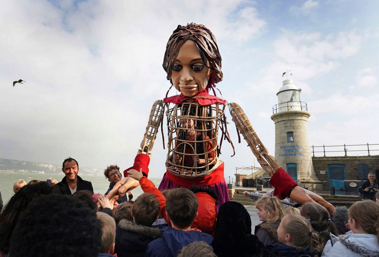 Puppet Little Amal arrives in UK after journey across Europe