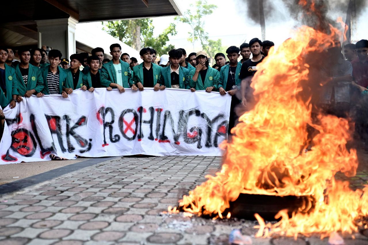 Indonesia's navy pushes a boat suspected of carrying Rohingya refugees ...
