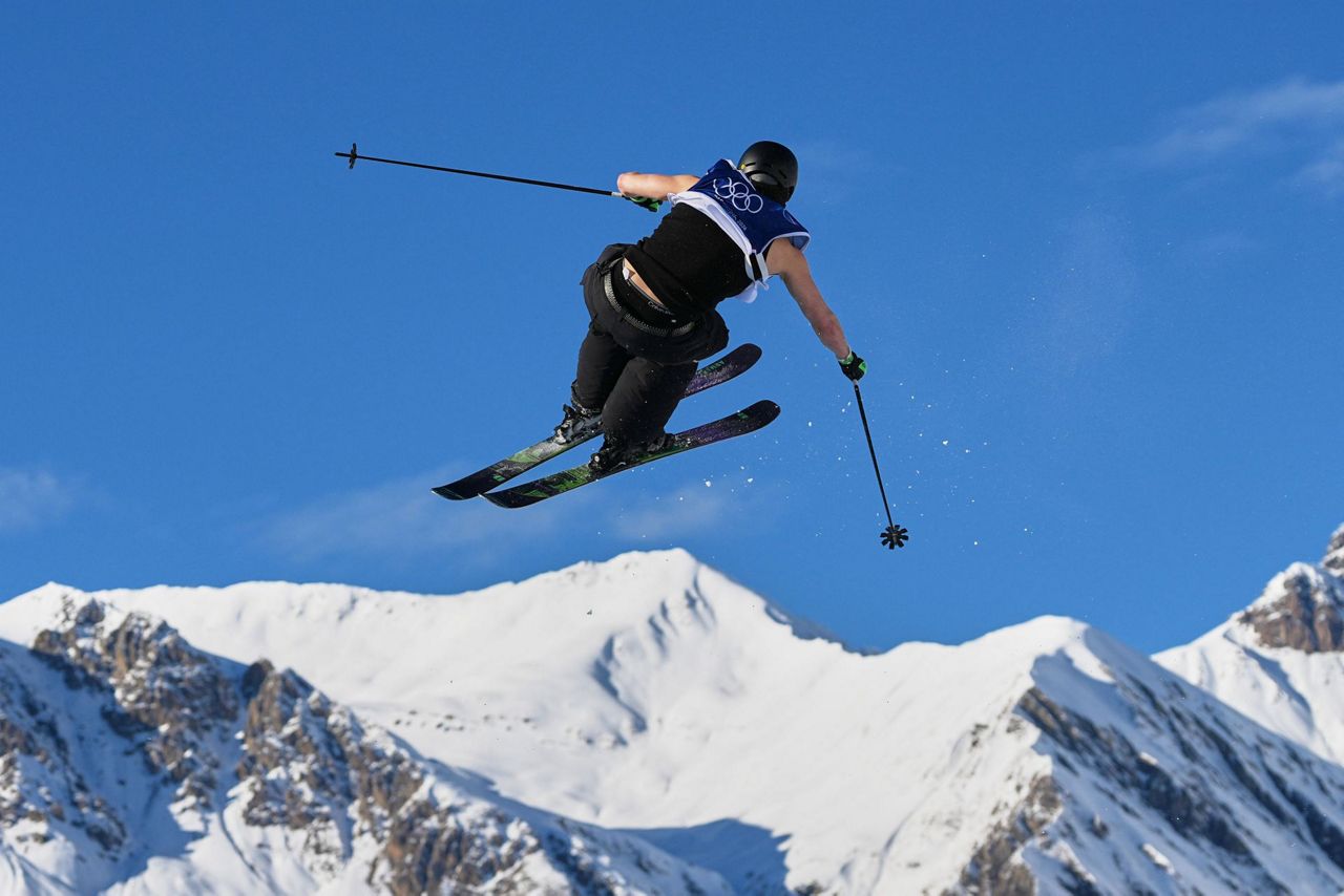 Olympic slopestyler shows some skin, skis down the mountain in a tank top
