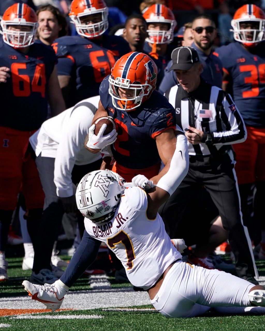 Brown's 180 yards, defense carry No. 24 Illini past Gophers