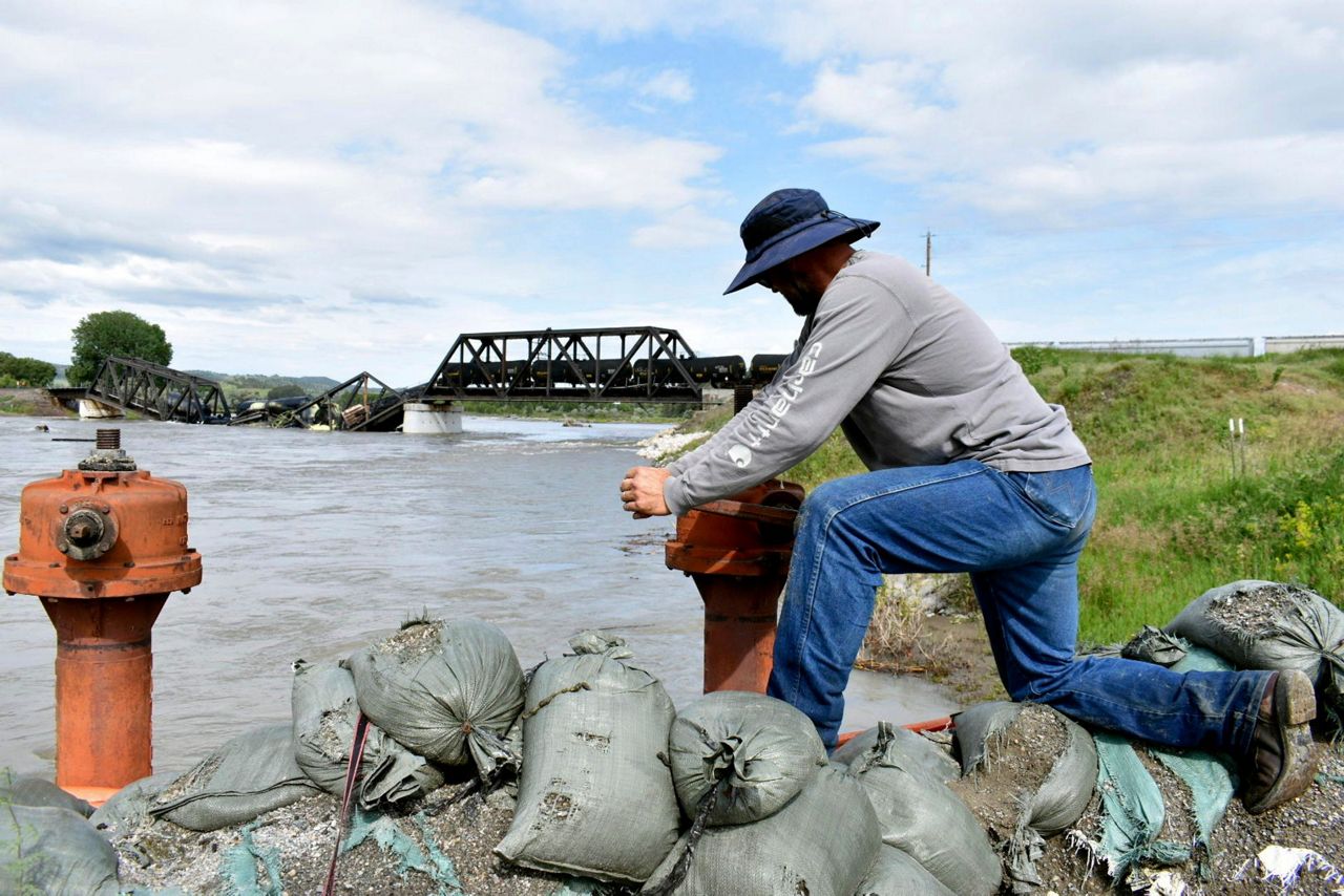 A bridge over Yellowstone River collapses, sending a freight train into ...