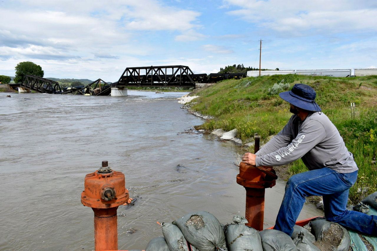 A bridge over Yellowstone River collapses, sending a freight train into ...