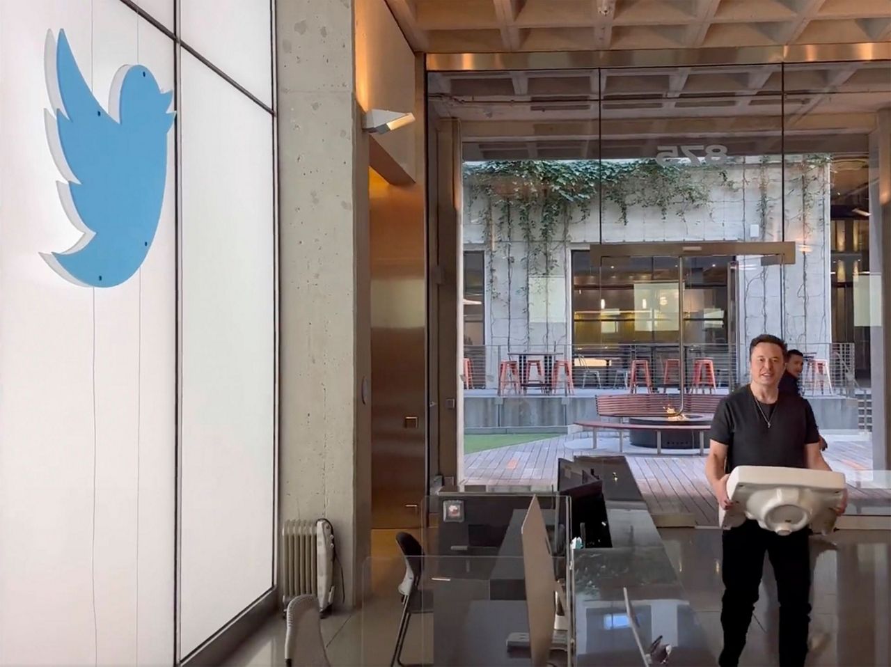 Musk posts video of himself strolling into Twitter HQ