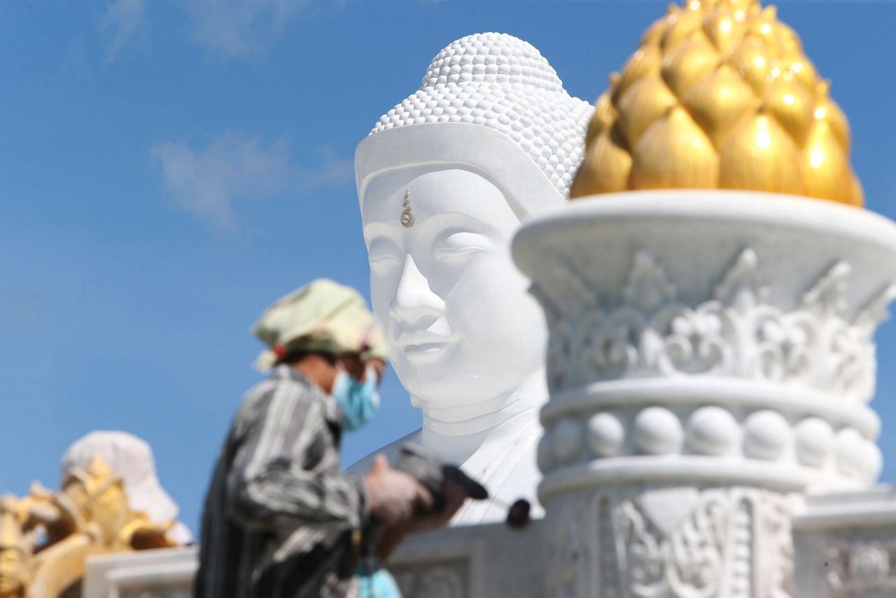Myanmar's generals unveil giant Buddha statue as they seek to win ...