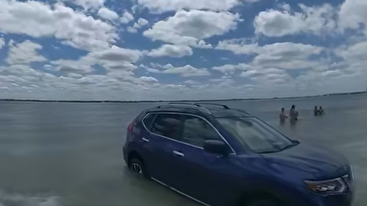 Woman arrested after witness say she sped down beach