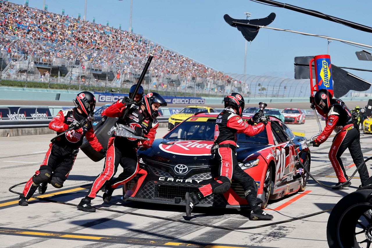 Larson wins NASCAR at Homestead, holding off Chastain at end