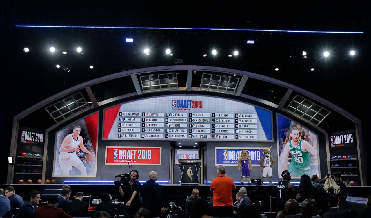 The Latest: Hawks trade up, get No. 4 pick from Pelicans