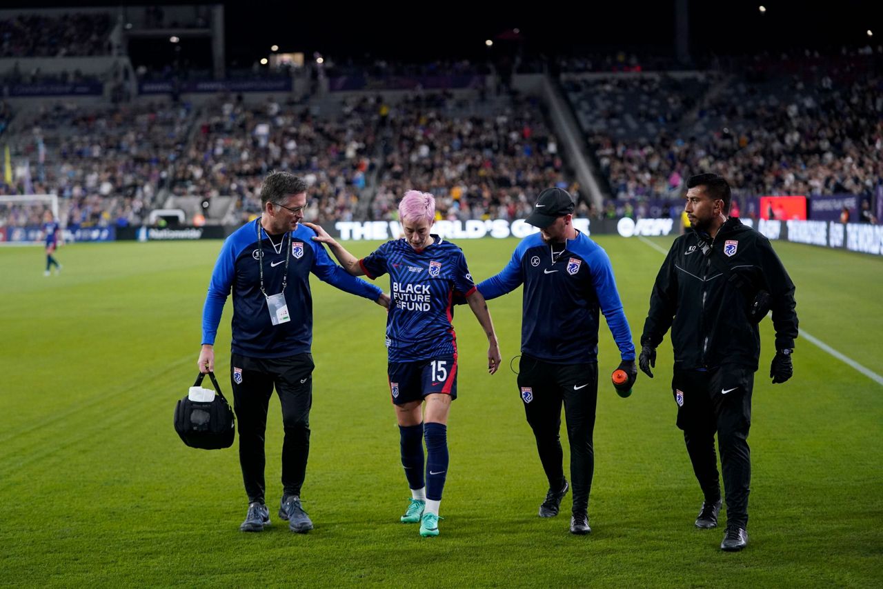 Megan Rapinoe hobbles off the pitch after injury early in the final ...