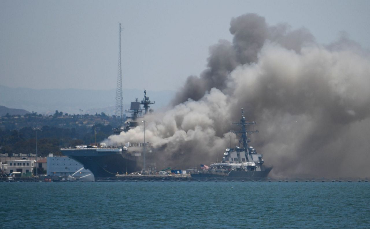 Navy charges sailor with setting fire that destroyed warship