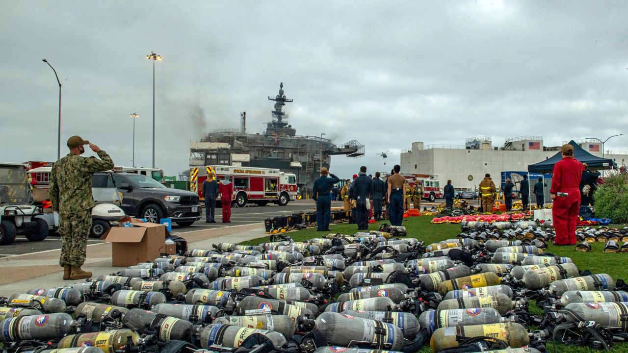 Explosion threat eases at burning Navy warship in San Diego