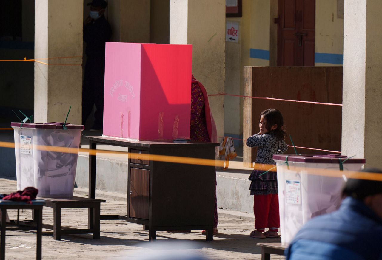 Voters in Nepal line up to elect new members of Parliament