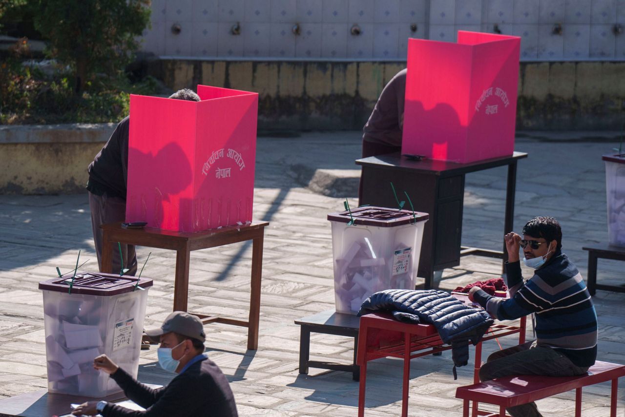 Voters in Nepal line up to elect new members of Parliament
