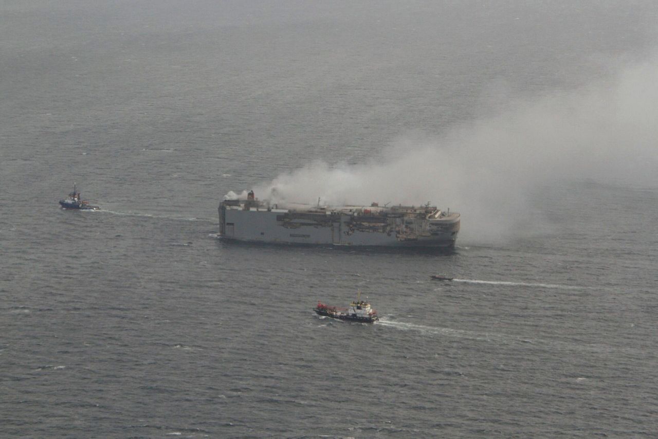 High winds stall efforts to tow a burning cargo ship packed with cars ...