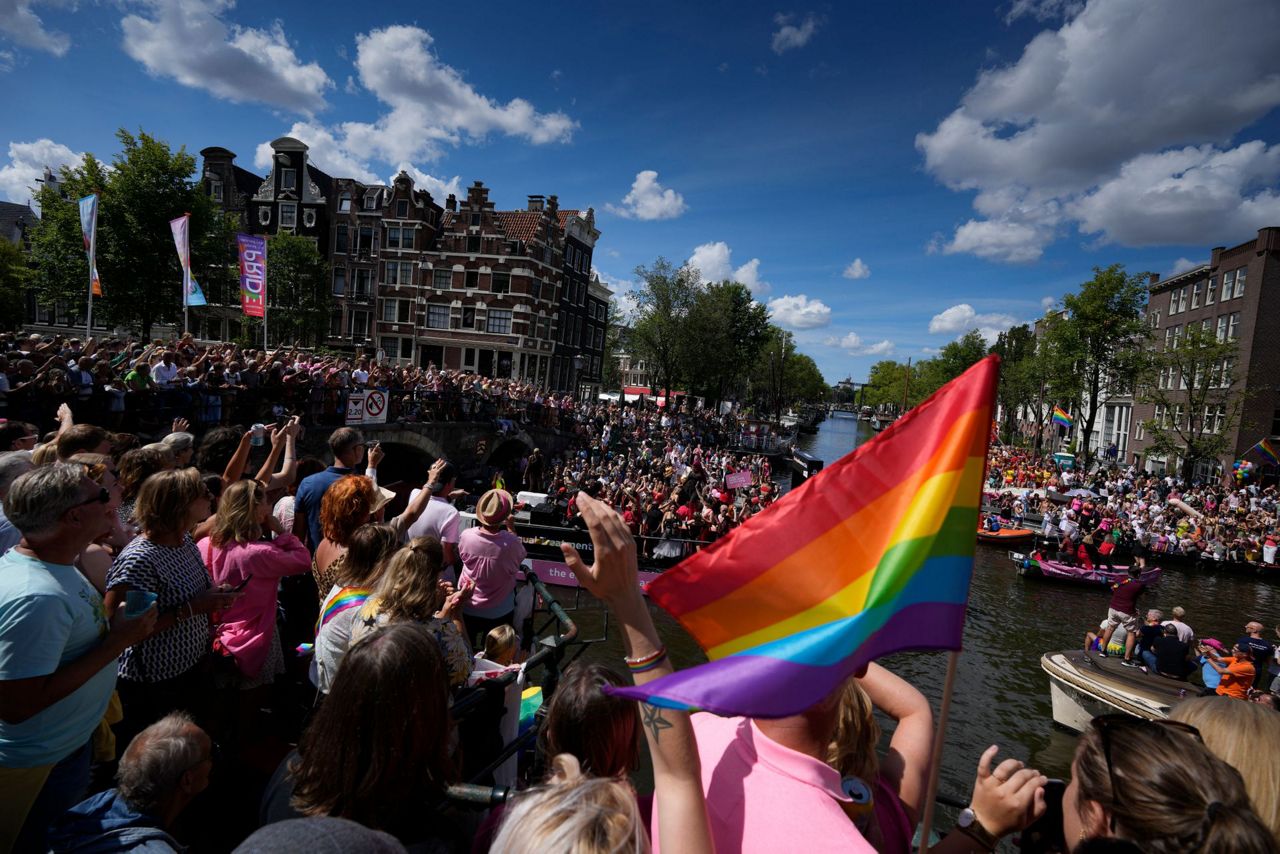 Huge crowds watch Amsterdam Pride's canal parade celebration