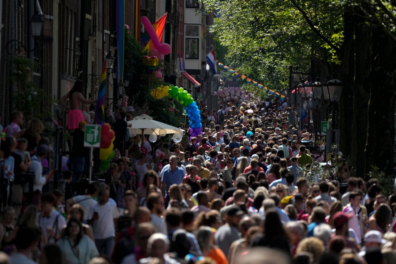 Huge crowds watch Amsterdam Pride's canal parade celebration